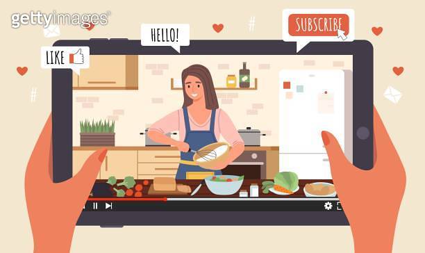 Cooking Live Streaming. Hands hold tablet with video, blogger prepares ...