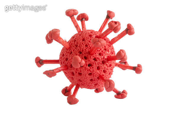 Red handmade model of coronavirus or the other virus isolated on the ...