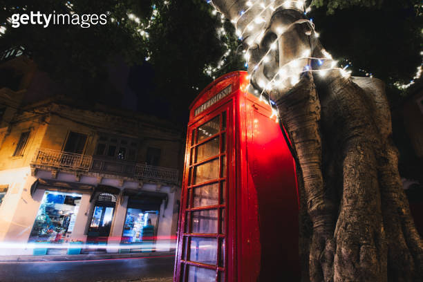 Red telephone box at night with light trails from cars 이미지 (1195643851 ...