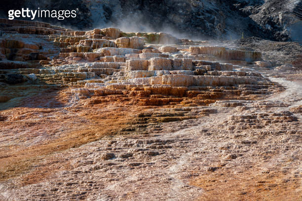 Geothermal flow of hot, carbonate rich water, forms cascading, dark ...