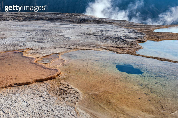 Geothermal flow of hot, carbonate rich water, forms cascading, dark ...