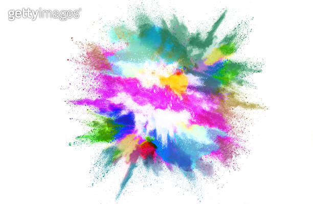 Freeze motion of colorful color powder exploding on white background ...