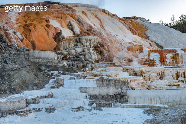 Geothermal flow of hot, carbonate rich water, forms cascading, dark ...