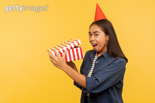 Wow, amazing present! Portrait of shocked excited girl in denim shirt ...
