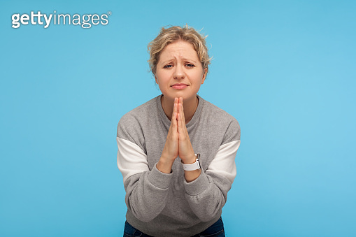 Please, I beg you! Upset woman looking with imploring beseeching ...
