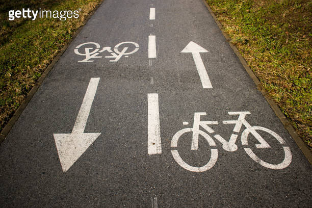 Bicycle track, two-way cycling lanes, painted bicycle symbol on asphalt ...