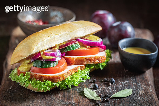 Tasty sandwich with roasted pork neck, cucumber and onion (1215887645 ...