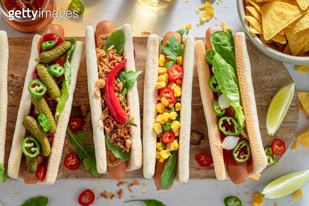 Unhealthy hot dogs with with sausage, sauce and vegetables (1267736537 ...
