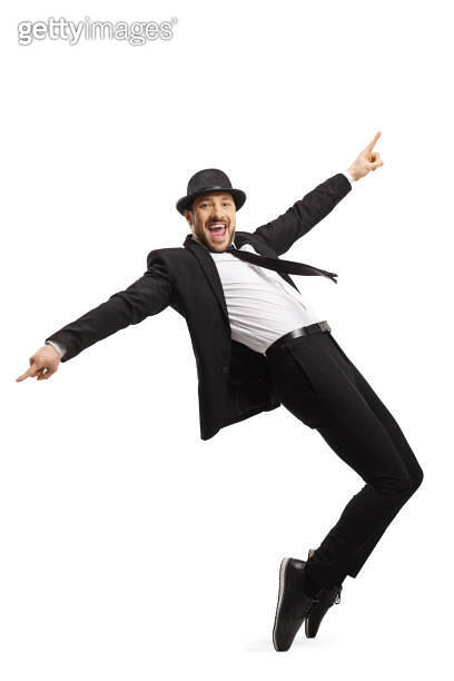 Smiling guy in a suit dancing and pointing with fingers 이미지 (1202463637 ...