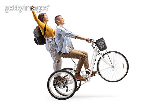 Students riding on a tricycle and gesturing happiness 이미지 (1212917605 ...