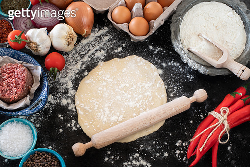 Turkish ravioli manti preparation with meat, yoghurt, butter and red ...