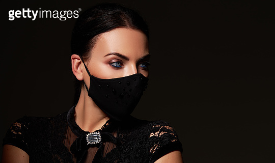 Stylish woman model wearing designer cloth face mask protect against ...