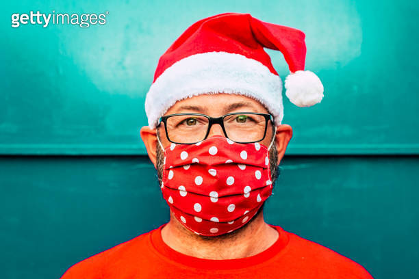Portrait of adult caucasian man wearing red protection mask for ...