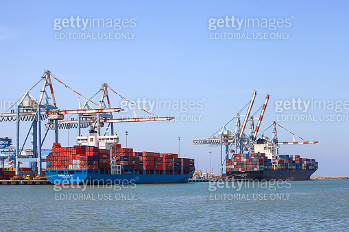 Large Container Ship docked at port during loading and unloading operation, Aerial view. 이미지 ...