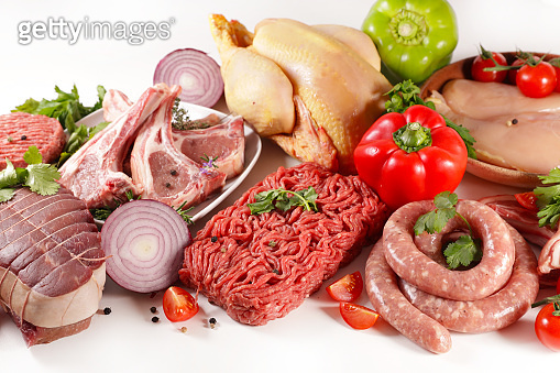assorted of raw meats on white background- roast beef, sausage, minced ...