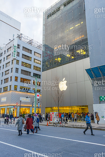 People walking in front of Apple store on Ginza street in Tokyo, Japan ...
