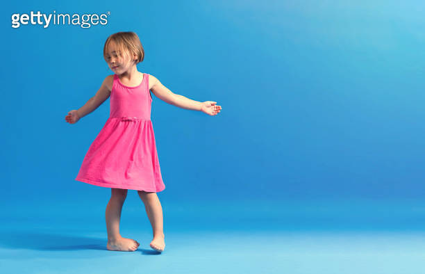 Little Happy Child Girl Dancing And Having Fun (1253273054) - 게티이미지뱅크