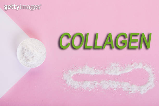 Collagen powder on a pink background. Extra protein intake. Natural ...
