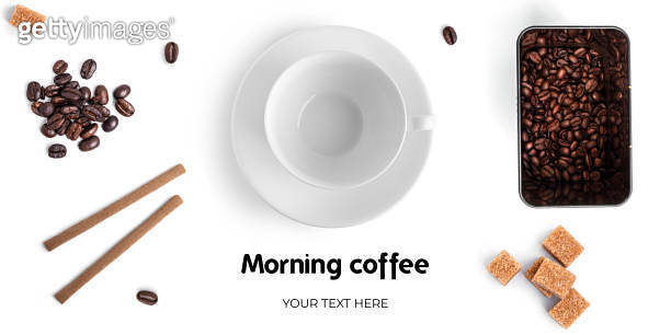 White cup, coffee beans and sweets on a white background. Long header ...