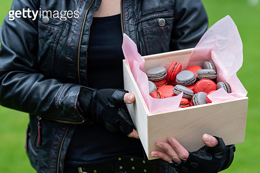 Red and gray french hazelnut macaroons cookies in a gift wooden box in ...