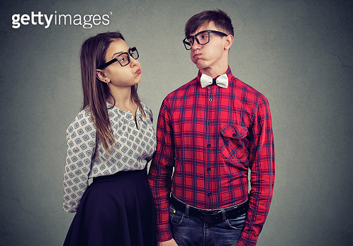 Grumpy couple puffing cheeks in offense 이미지 (1272257886) - 게티이미지뱅크