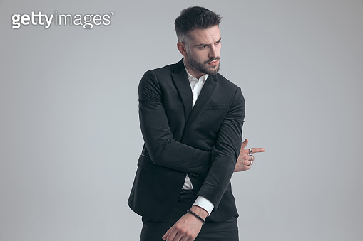 Confident elegant man holding arms crossed and pointing 이미지 (1279940871 ...