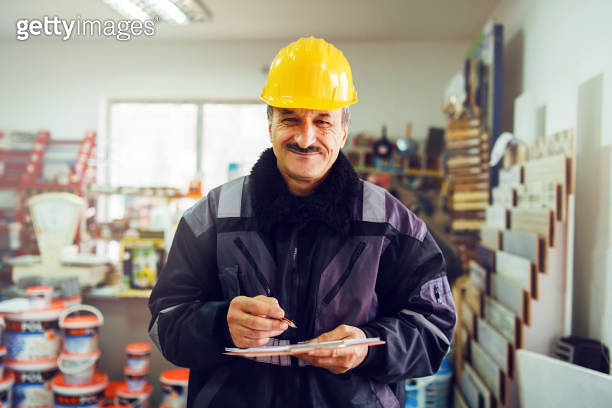 Portrait of caucasian senior man construction worker general laborer building contractor wearing ...
