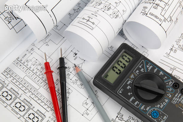 paper engineering electronic drawings, pencils and digital multimeter ...