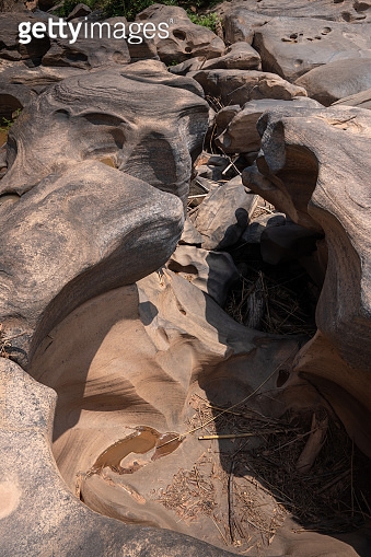 Stone courtyard Potholes in nature erosion by the currents, gravel ...