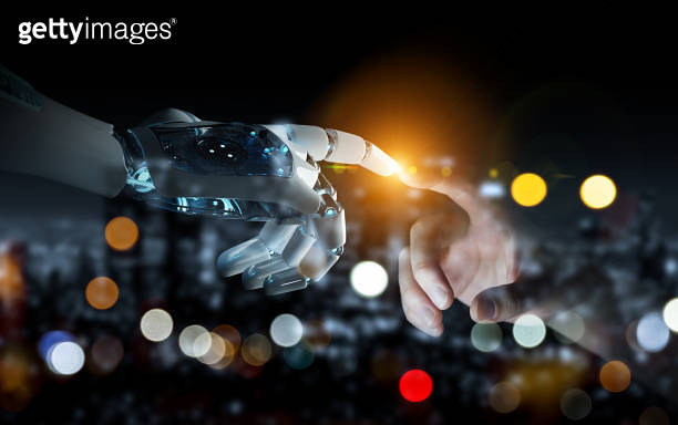 Robot hand creating electricity with human hand on dark background 3D ...