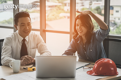 Female Engineer Construction is presenting her project to her ...