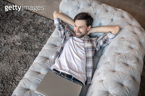 Successful handsome man relaxing at home on the couch. 이미지 (1224608611 ...