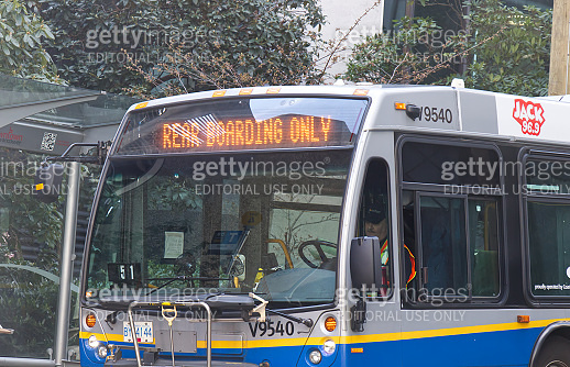 Translink bus with sign "Rear Boarding Only" due to COVID-19 ...