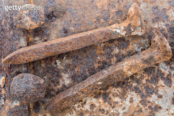Old rusty nails for fastening rails and sleepers on railway track ...