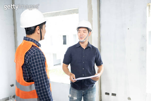young asian with foreman engineering home inspection building house he ...
