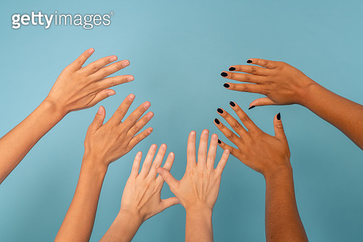 Three pairs of female hands of various ethnicities with different color ...