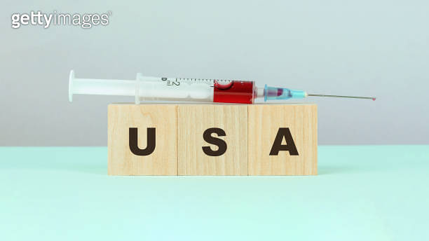 usa inscription on wooden blocks under syringe with dose 이미지 ...