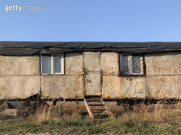 Home made house for the poor. Mobile housing for builders. Old rusty ...