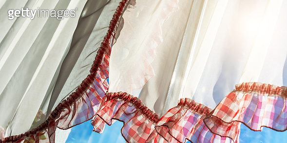 white curtains with red frills against blue sky closeup 이미지 (1254642438 ...