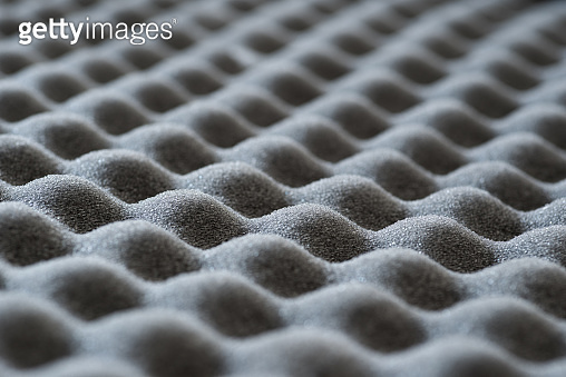 Macrophotography of gray wavy soundproof acoustic foam with selective ...