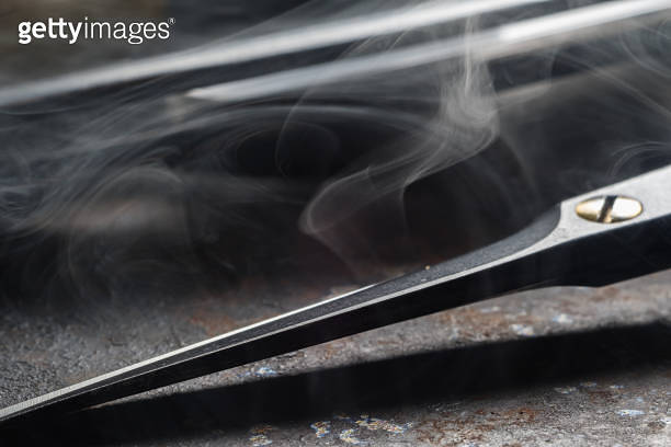 On a rusty surface are old hairdresser tools. hairdressing scissors ...