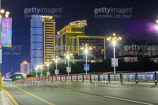 Night view of Sanya city with bright multi-colored illumination ...