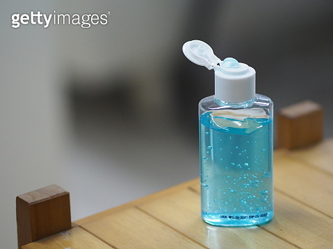 hand wash gel in Plastic bottle on wooden desk, clean to prevent germs ...