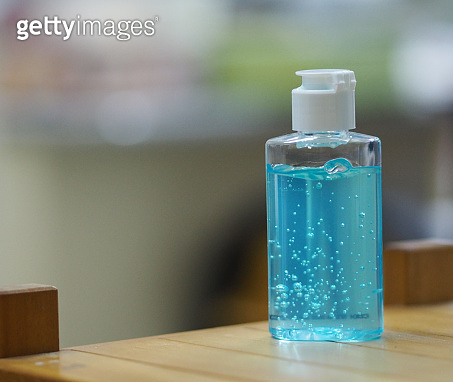 hand wash gel in Plastic bottle on wooden desk, clean to prevent germs ...