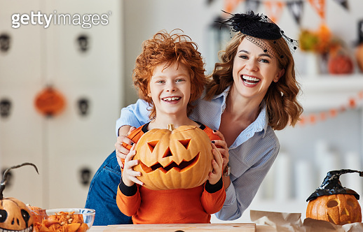 happy family mother and son laughing and getting ready for Hallo ...