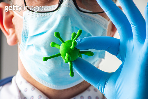 Medical worker, doctor, scientist holds in hand 3D model of virus ...