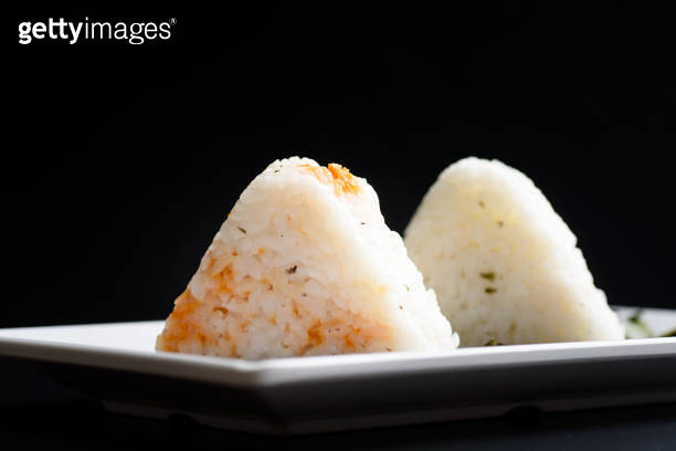 Onigiri, a Japanese food that looks like a triangle or ball oval ...