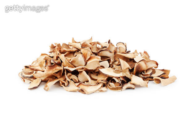 Edible dried mushrooms pile on white background isolated close up, heap ...