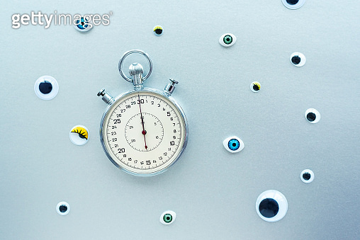 Abstract composition with stopwatch and eyes. Create conceptual with ...