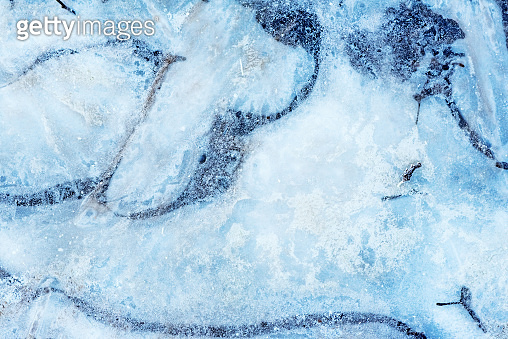 Surface of natural ice covering on water in winter. Ice texture with ...